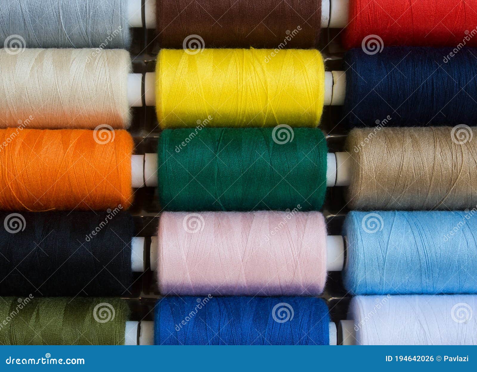 Threads of Different Colors on Spools, Regularly Arranged in Rows, 2 ...