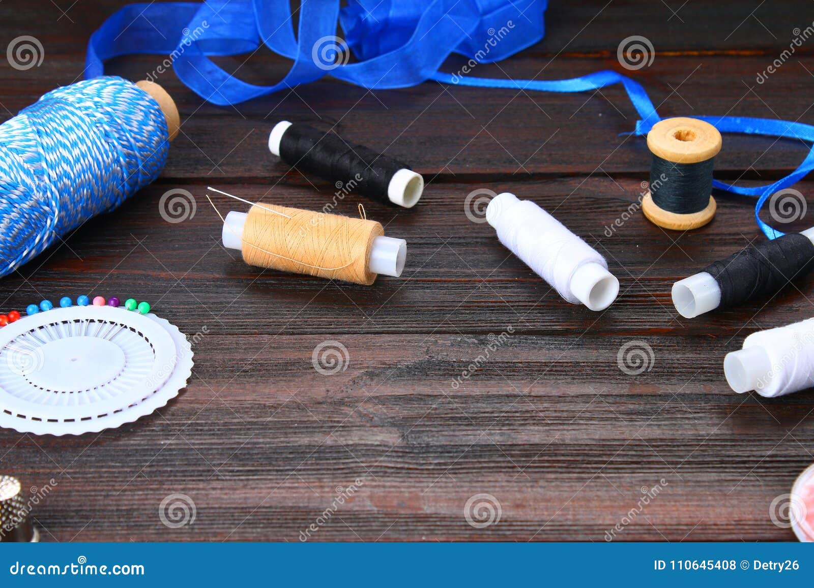 Threads, Needles, Pins. Tools for Sewing on a Wooden Table. Stock Photo ...