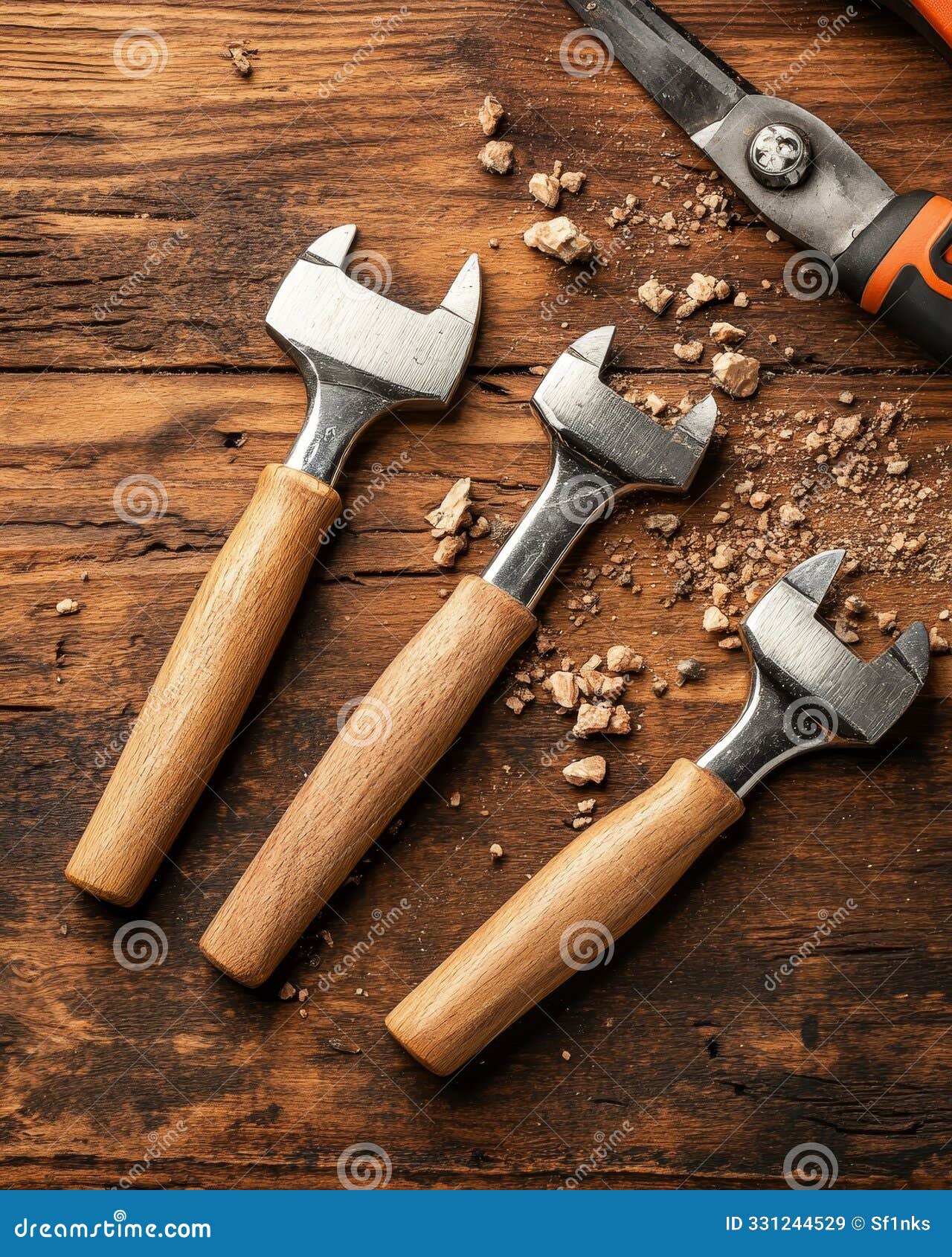 Three Adjustable Wrenches with Wooden Handles on Textured Wooden ...