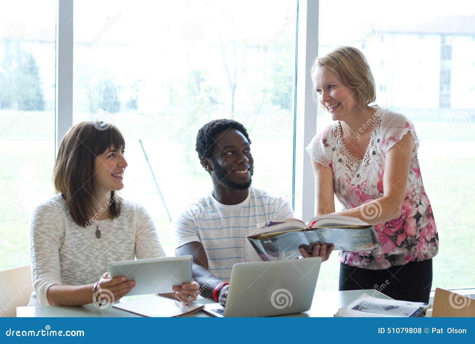 Three adults share a laugh stock photo. Image of medicine - 51079808
