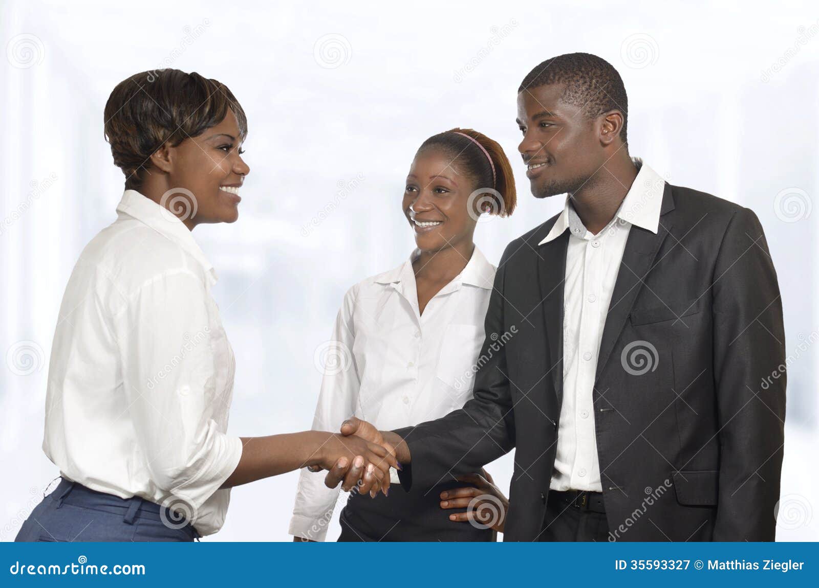 Three African Business Partner Shake Hands at Meeting Stock Image ...