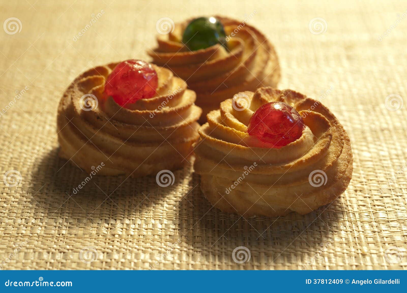 Three almond pastries stock image. Image of cherry, pastries - 37812409