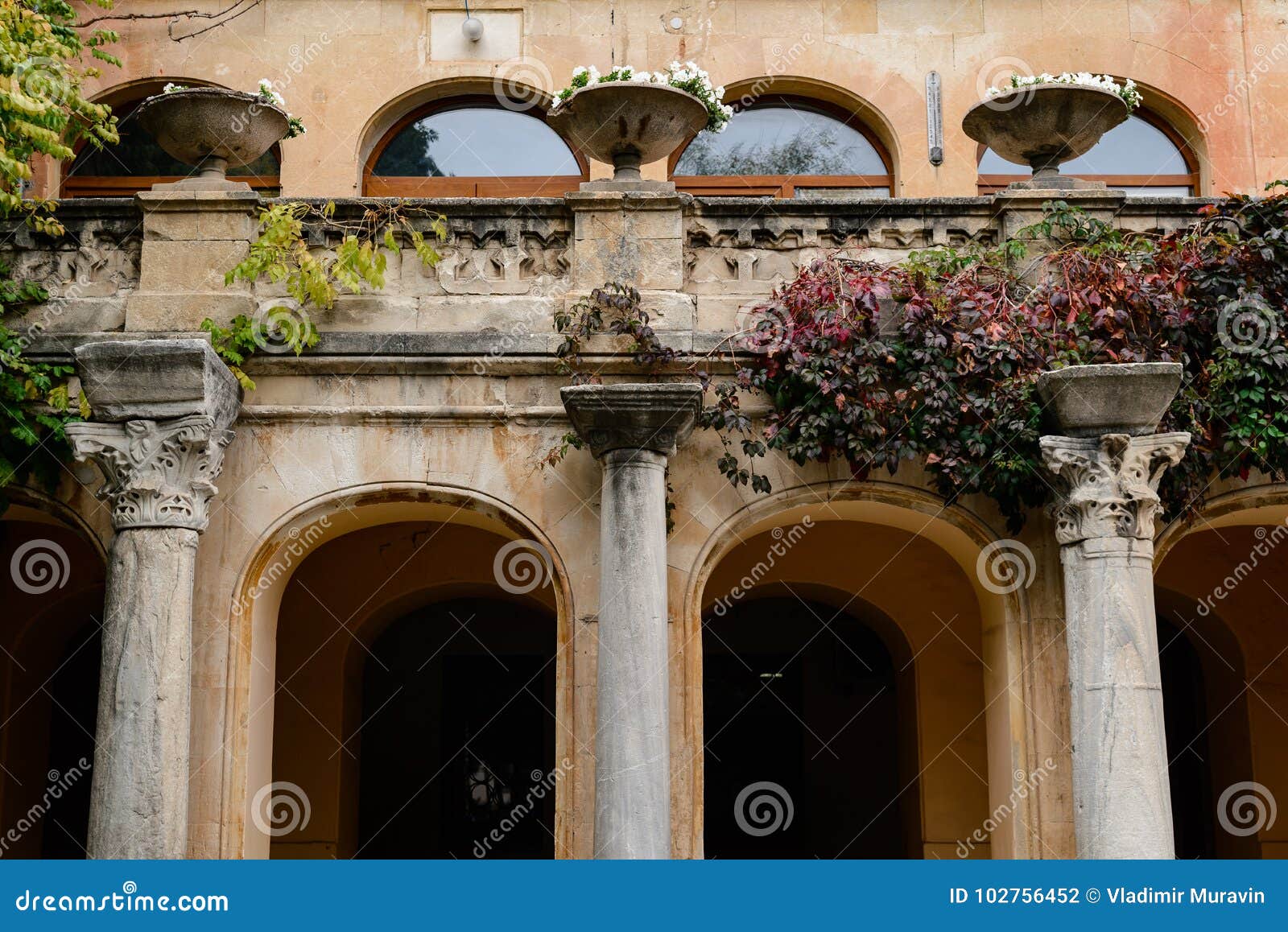 Three Ancient Columns on the Facade of the Building Stock Photo - Image ...