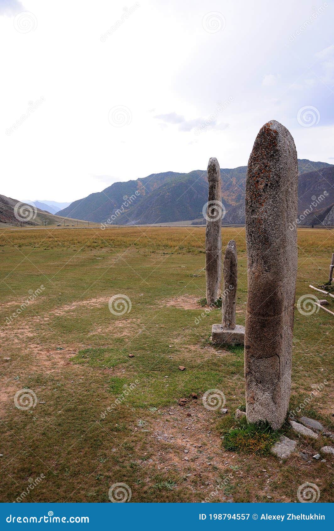 Three Ancient Stone Statues Stand in a Row in the Center of the ...