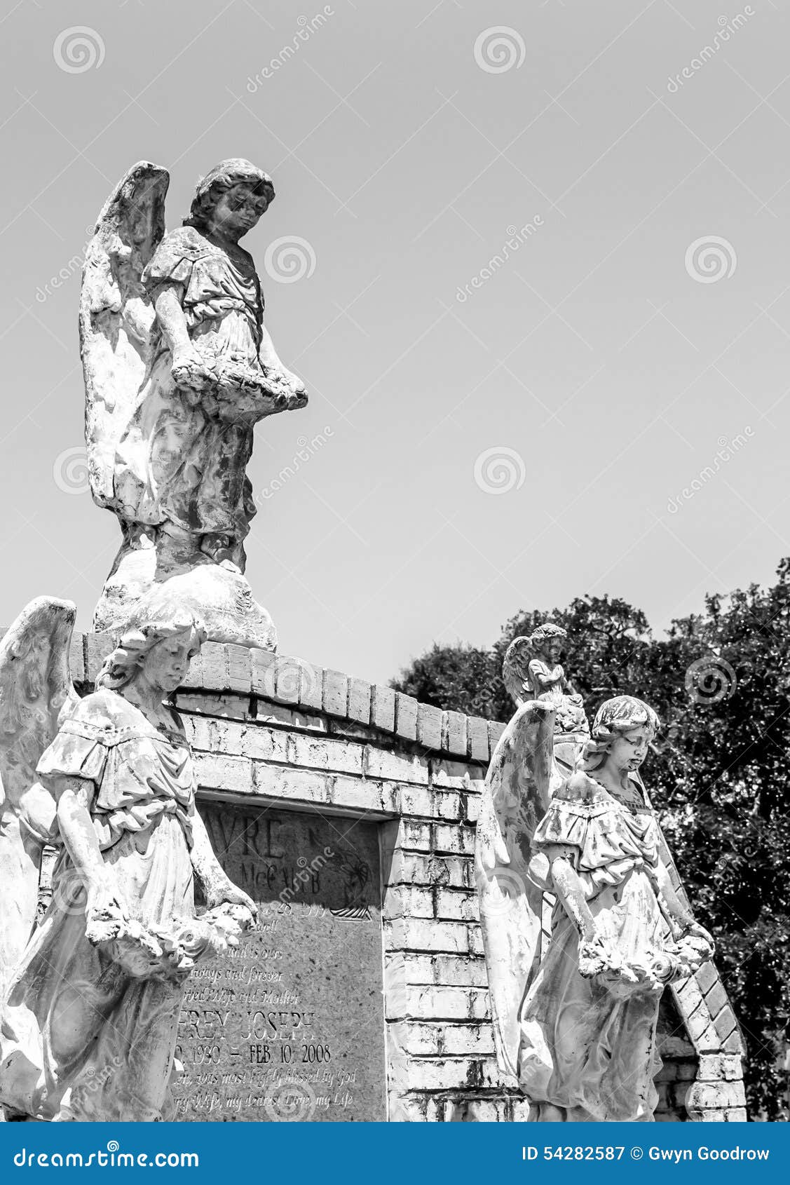 Three angels in cemetery stock image. Image of flowers - 54282587