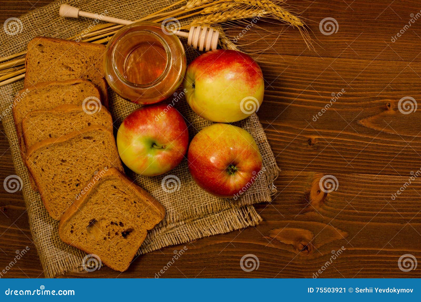 Three Apples, Slices of Rye Bread, Honey, Wheat Ears on Sacking Stock ...