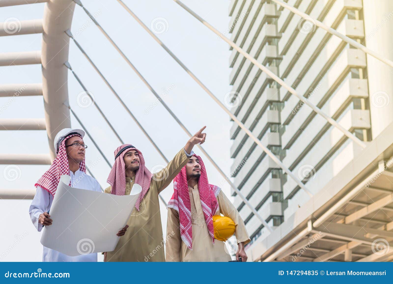 Three Arabian Engineer Hold the Blueprint and Conference Talking about ...