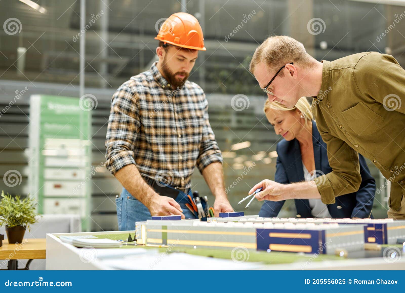 Three Architects Concentrated on Work Stock Image - Image of holding ...