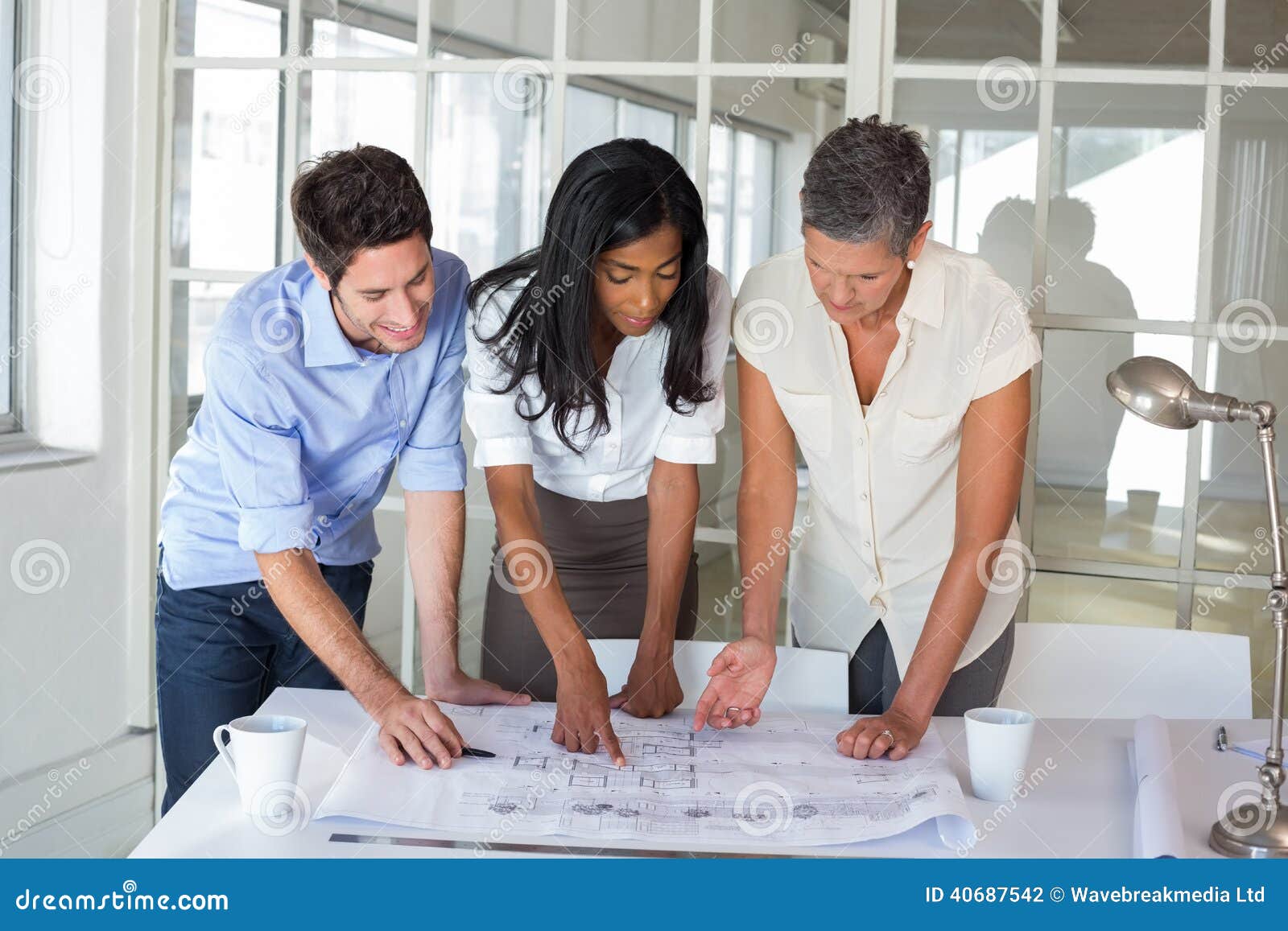 Three Architects Looking at Blueprints Stock Photo - Image of career ...