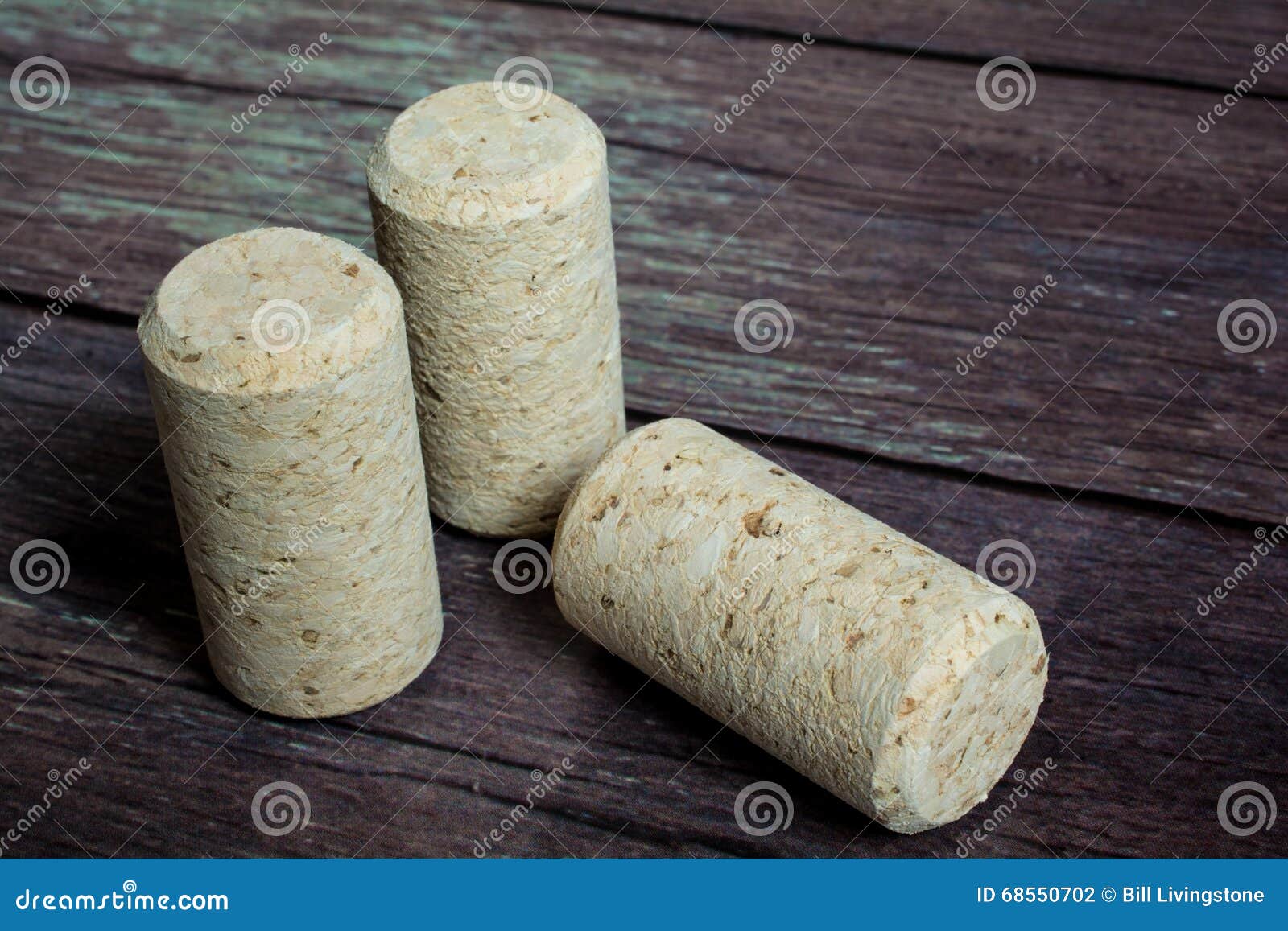 Three Assorted Cork Stoppers on a Old Barn Board Floor Stock Photo ...
