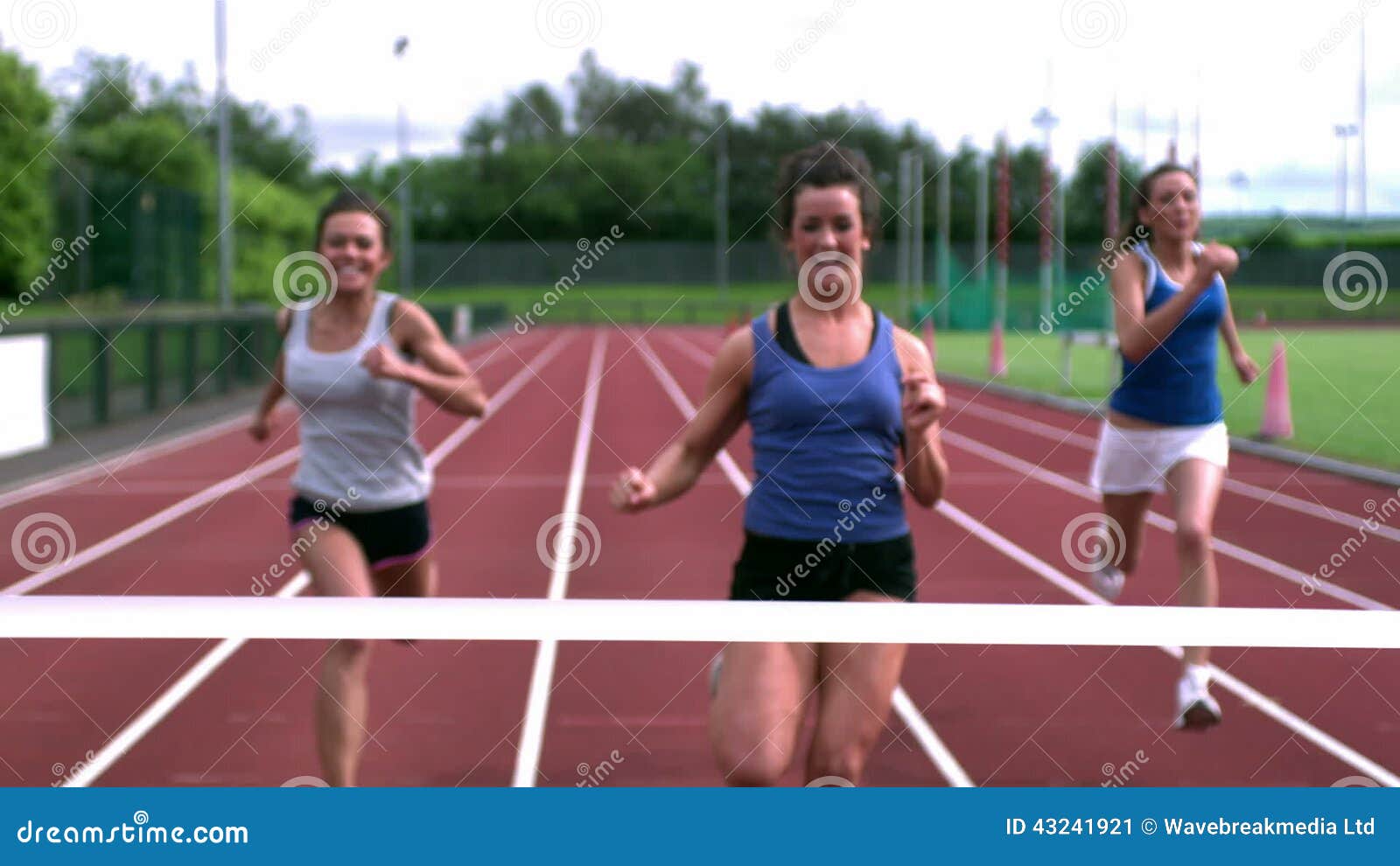 Three Athletes Running Towards the Finish Line Stock Video - Video of ...