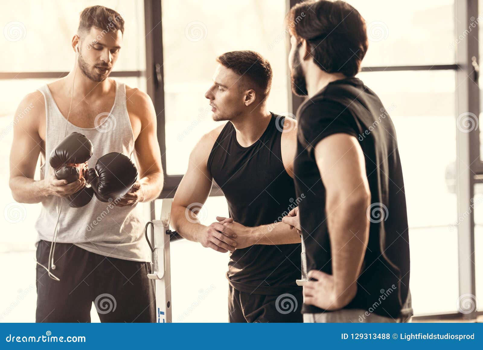 Three Athletic Young Men on Sportswear Talking Stock Photo - Image of ...