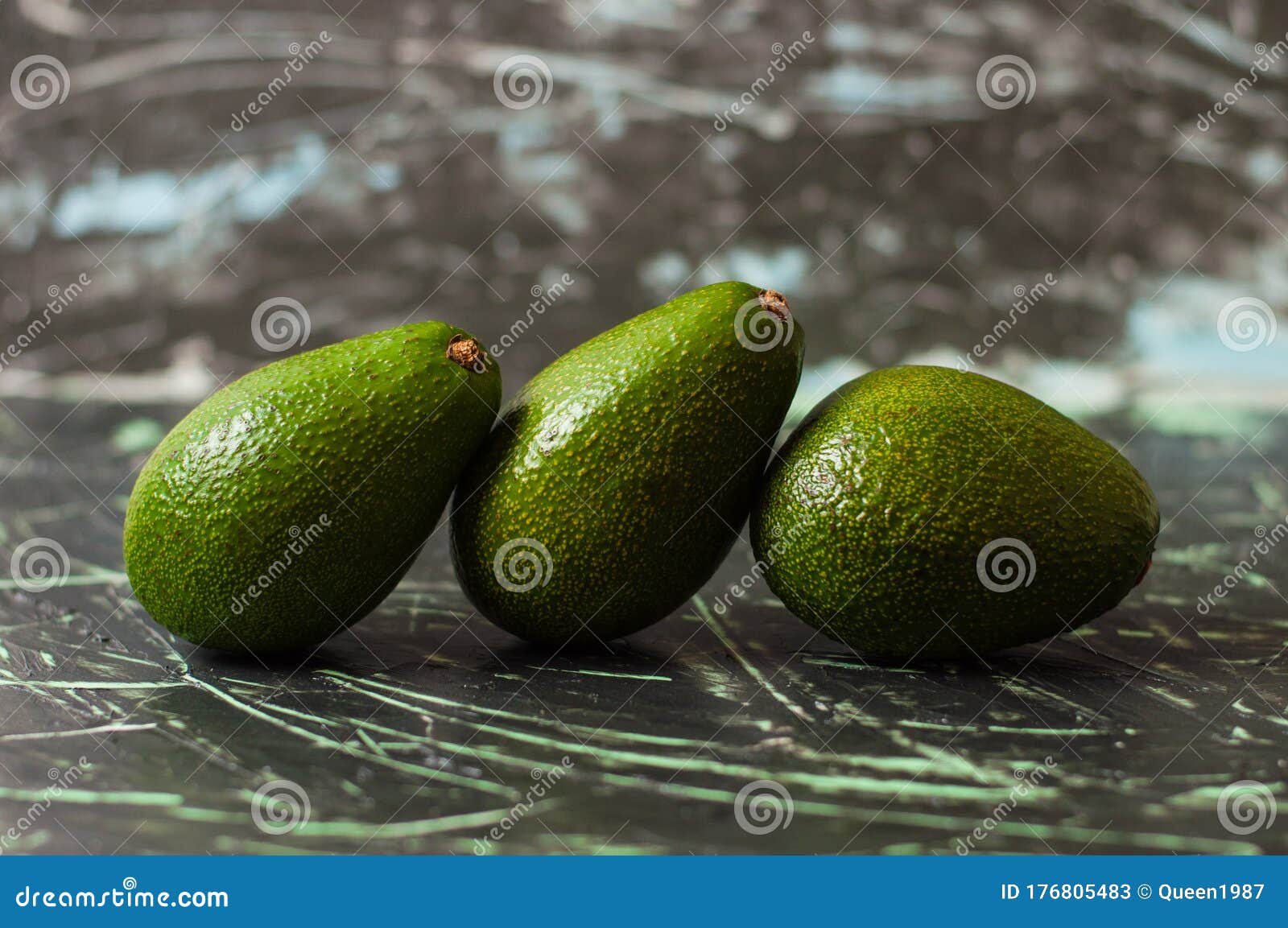 Three Avocados on a Dark Background, Side View Stock Image - Image of ...