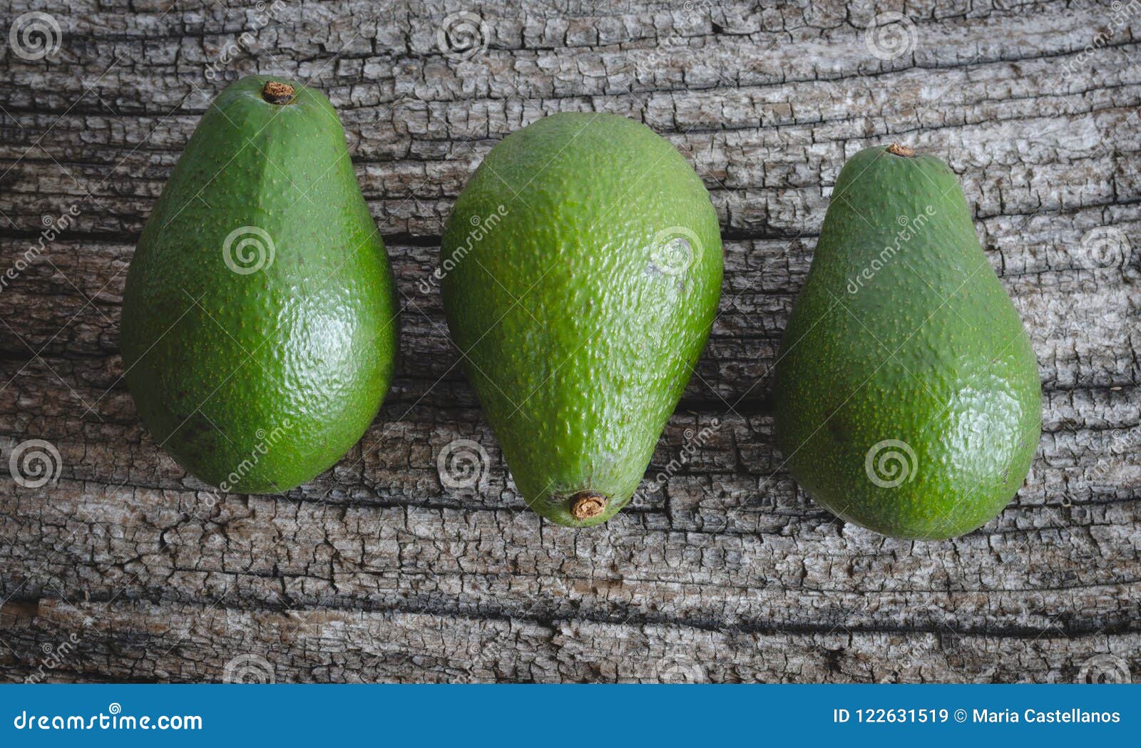 Three Avocados on Rustic Table. Top View Stock Image - Image of market ...