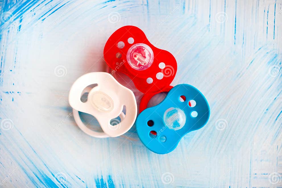 Three of Babies Silicone Dummies Pacifier Stock Photo - Image of care ...