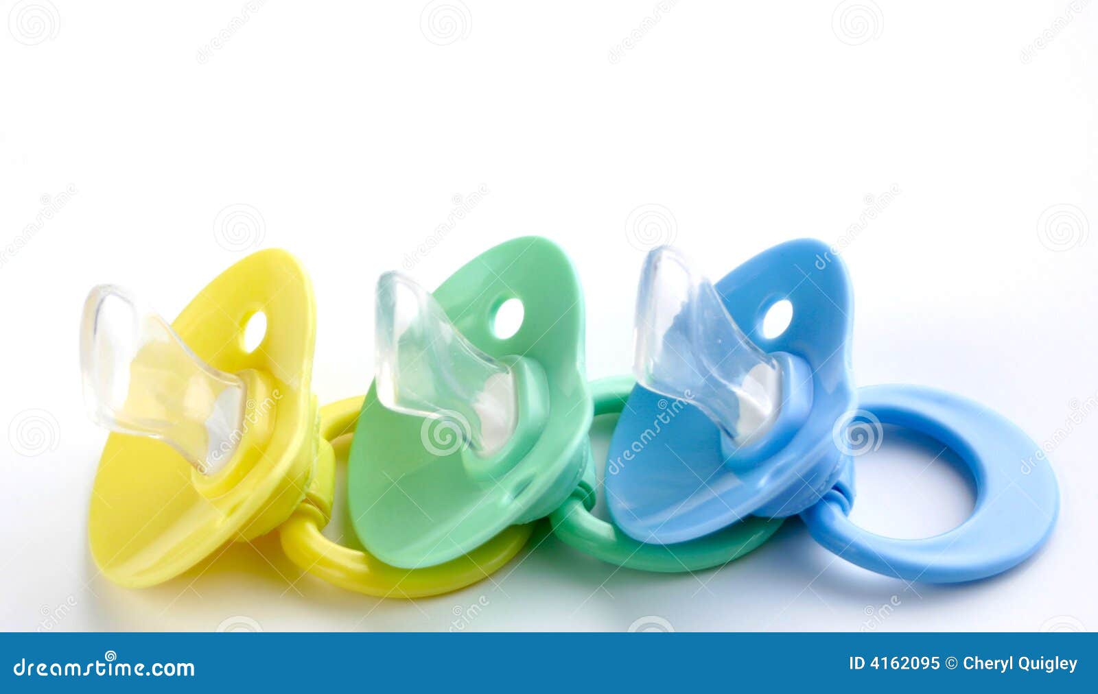 Three Baby Pacifiers stock image. Image of maternity, soothe - 4162095