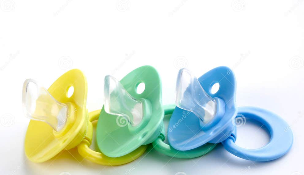 Three Baby Pacifiers stock image. Image of maternity, soothe - 4162095