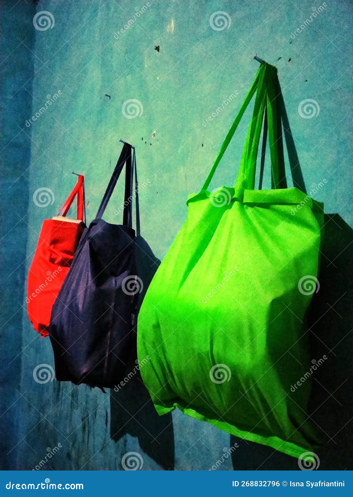 Three bags on the wall stock photo. Image of colour - 268832796