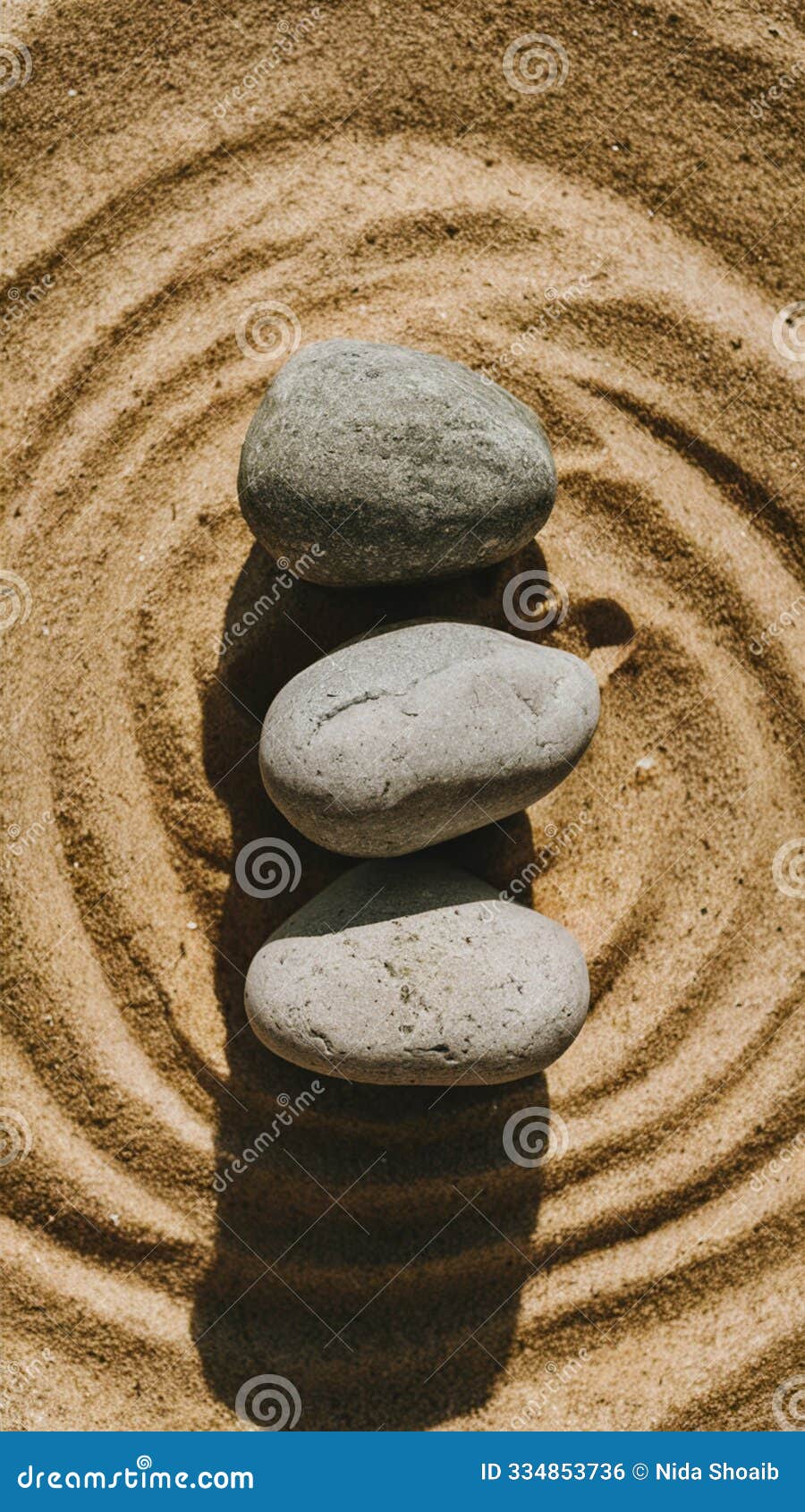 Three Balanced Stones on Sandy Surface, Intricate Patterns Create ...