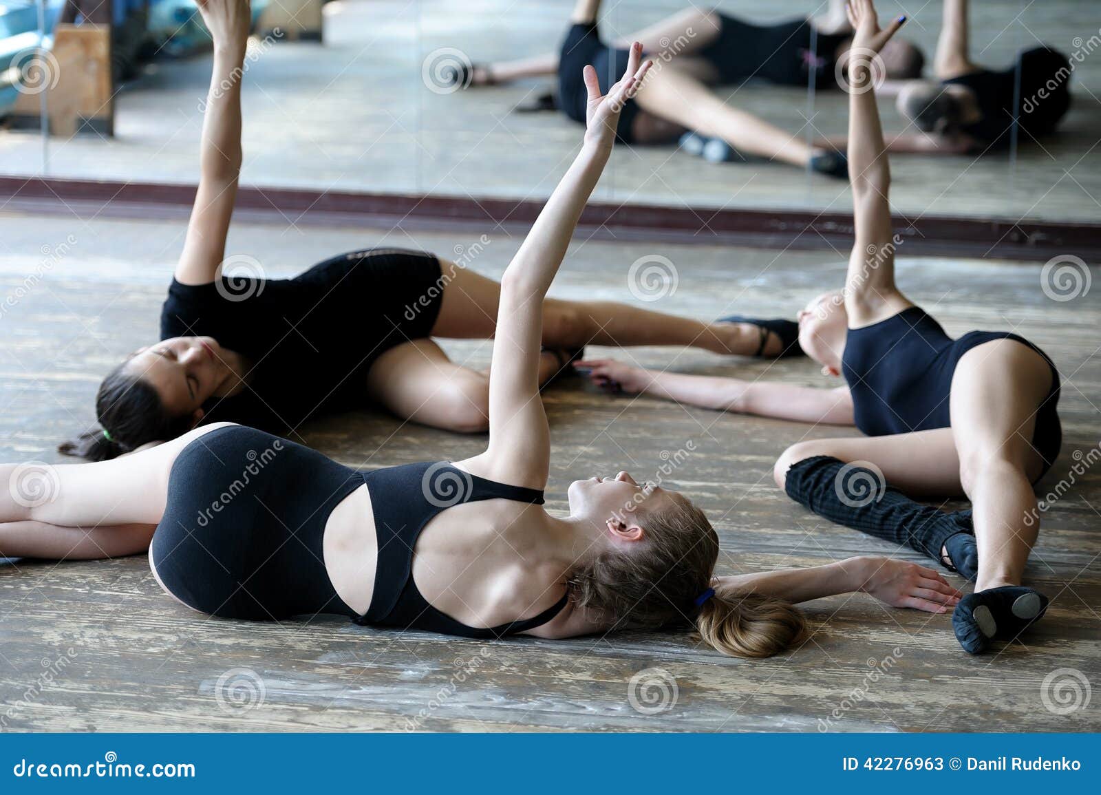 Three Ballet Dancers On The Floor During Rehearsal Stock Image Image