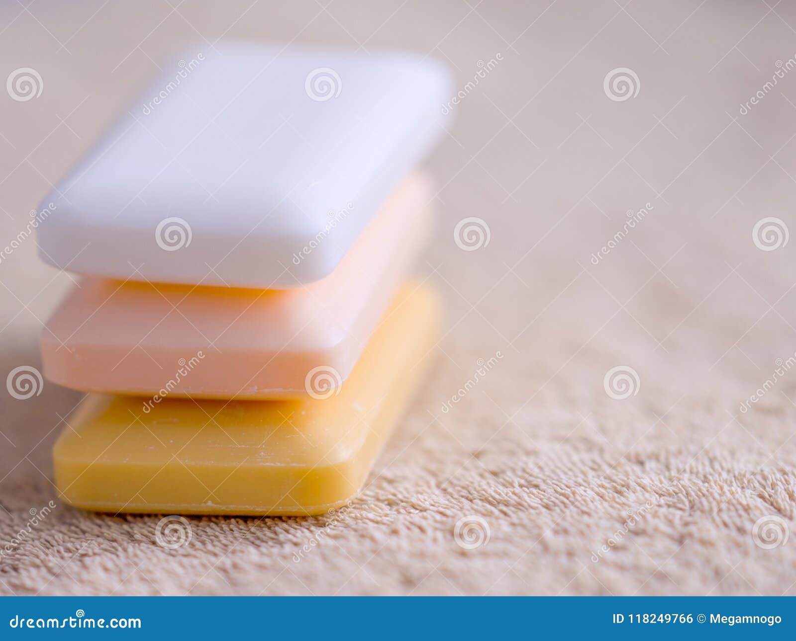 Three Bars of Soap on a Towel Stock Photo - Image of indoor, blur ...