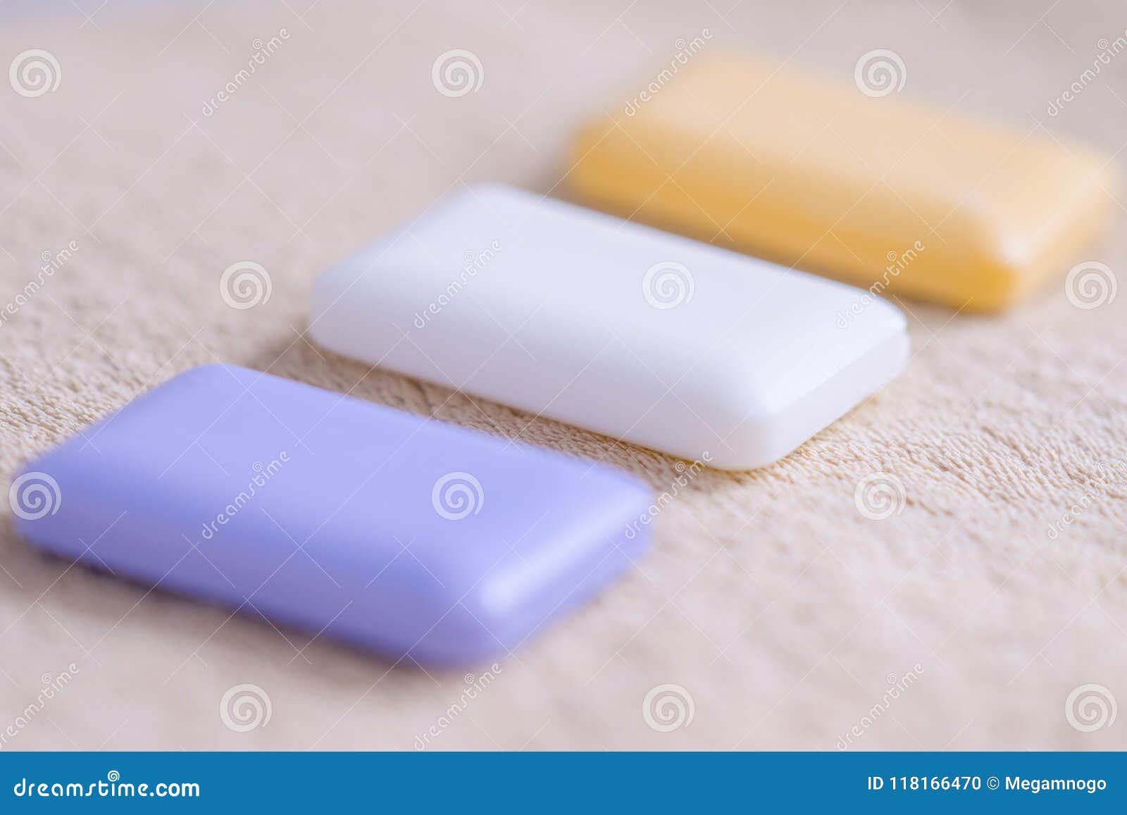 Three Bars of Soap on a Towel Stock Photo - Image of magenta, design ...