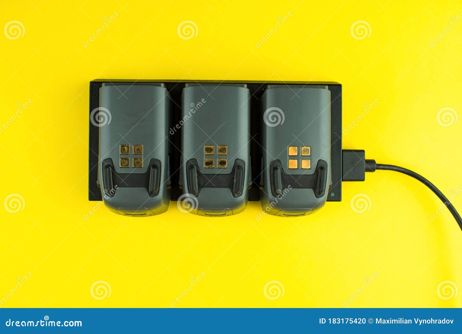 Three Batteries are Charging. Fast Battery Charging with a Hub Stock ...