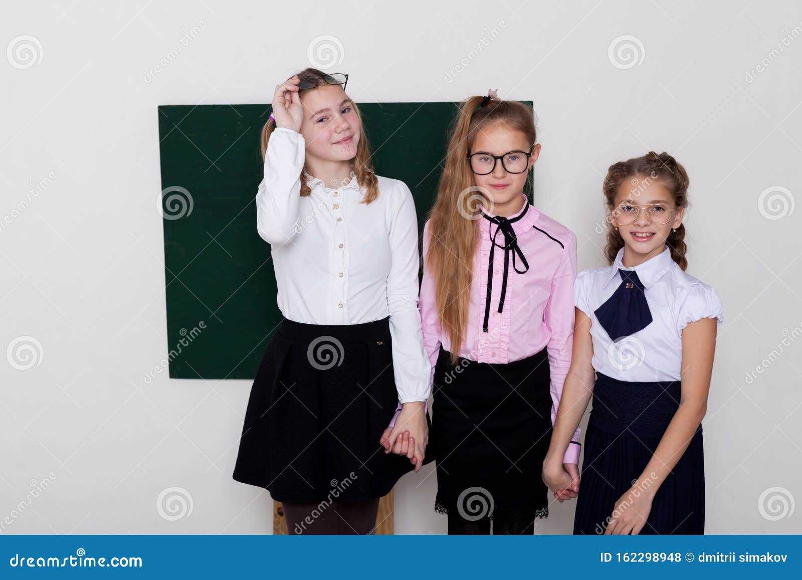 Three Beautiful Girls at the School Board in Class in Class Stock Photo ...