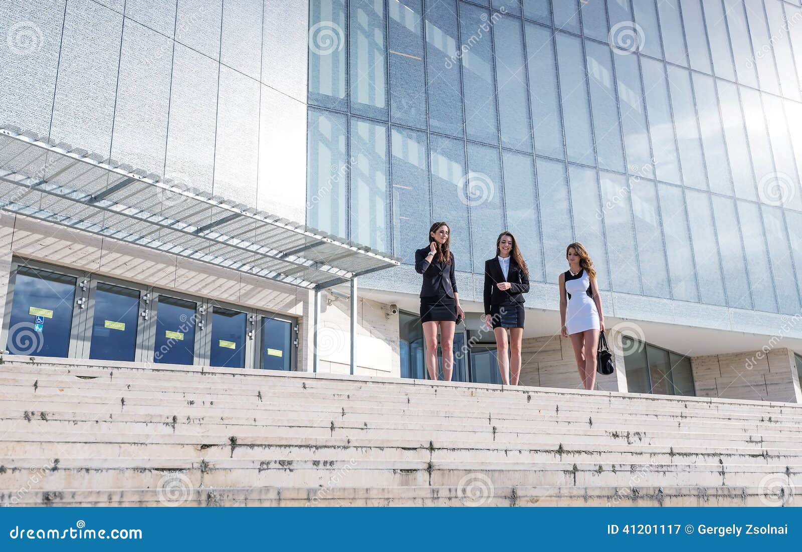 Three Beautiful, Pretty Businesswoman in Front of a Modern Building ...