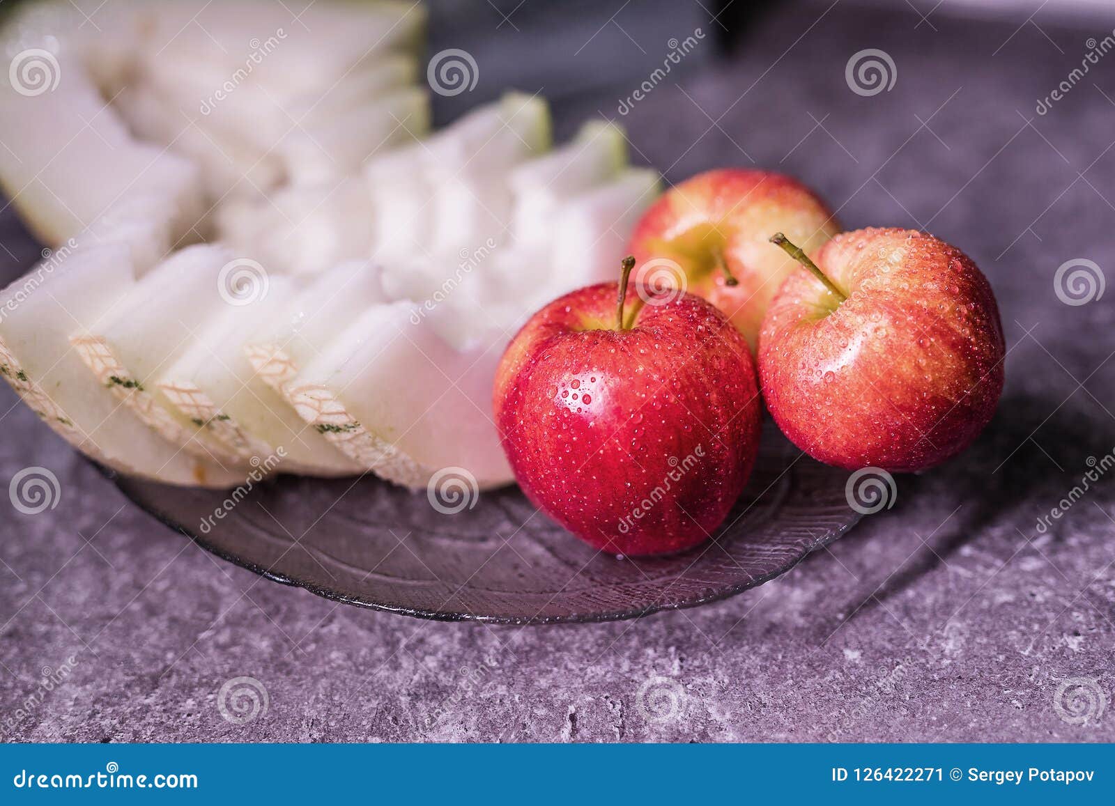 Three Beautiful Red Apples and a Melon on a Plate. Stock Image - Image ...