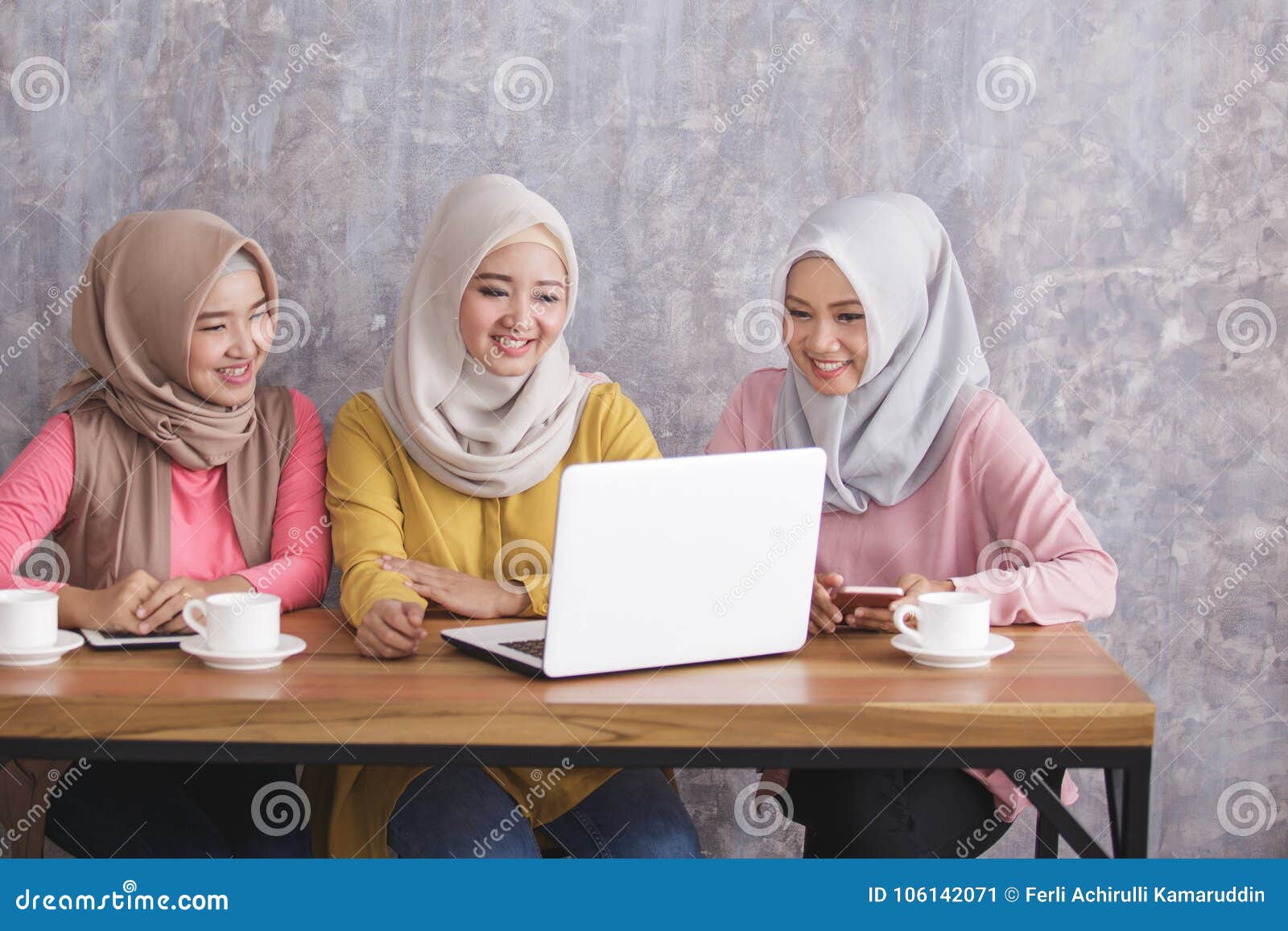 Three Beautiful Siblings Discuss Their Project at Cafe Stock Image ...