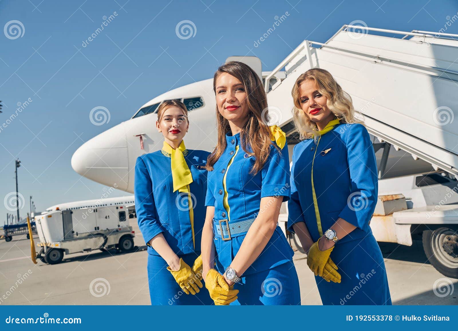 Three Beautiful Stewardesses Posing for the Camera Stock Photo - Image ...