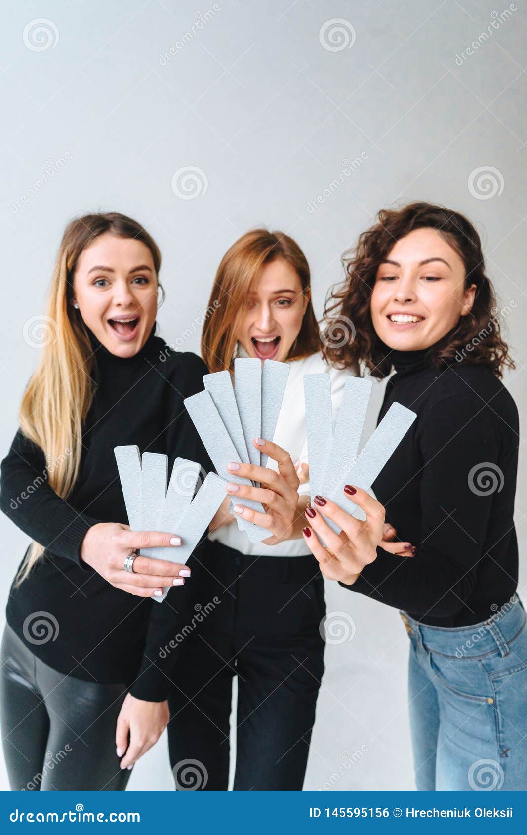 Three Beautiful Young Girls Posing for the Camera Stock Photo - Image ...