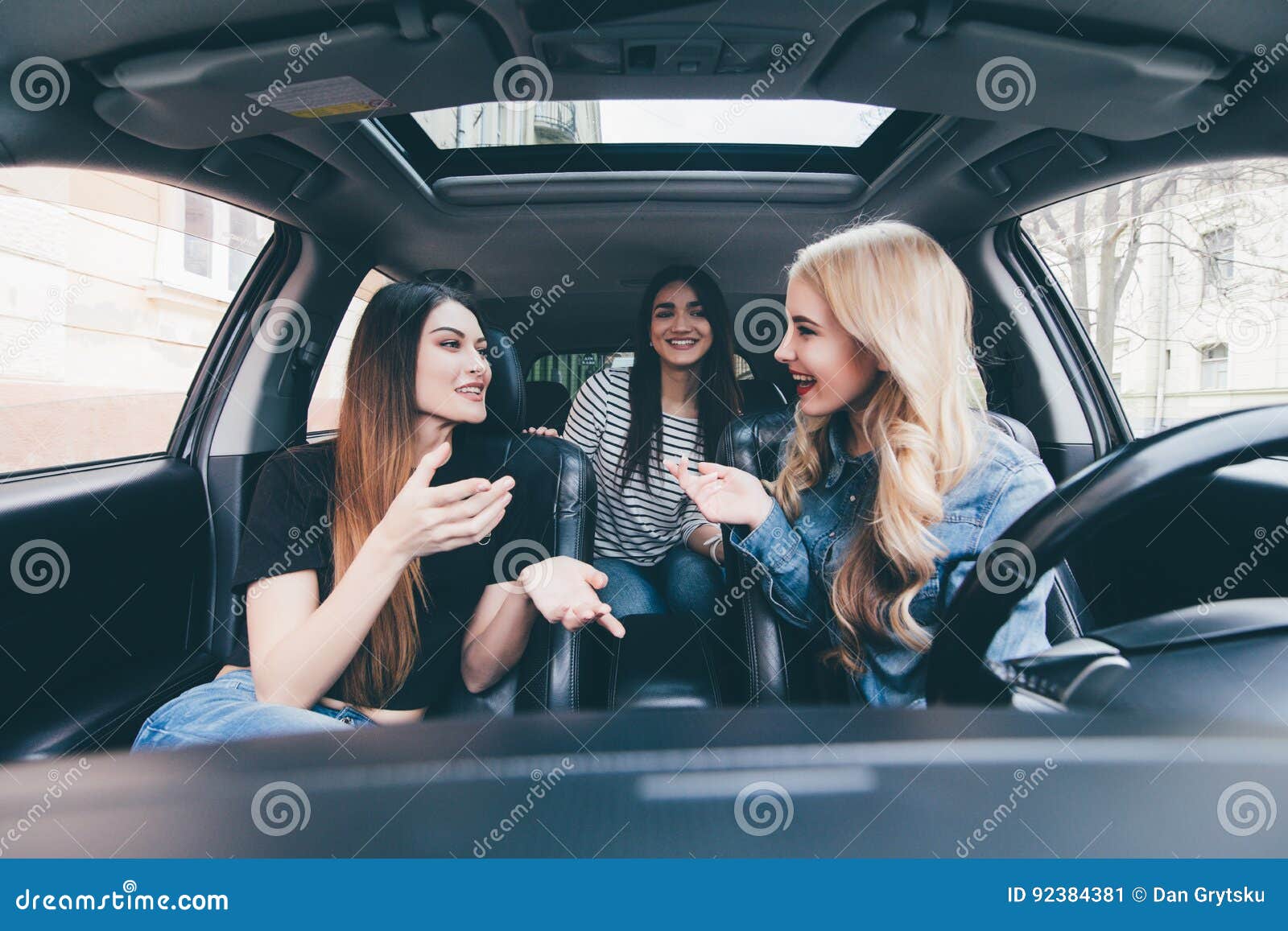 Three Beautiful Young Women Friends Have Fun Together In The O Car As