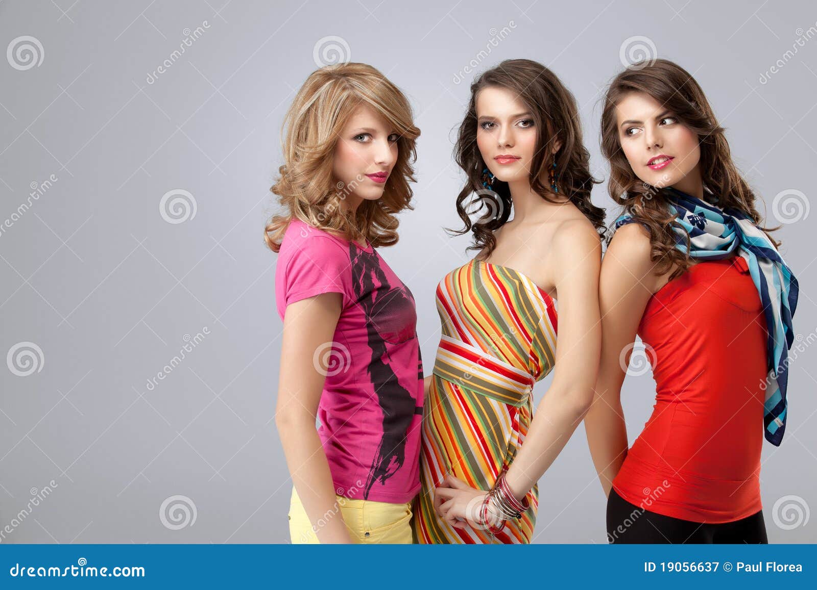 Three Beautiful Young Girls With Their Hands Up Happily. Isolated On ...