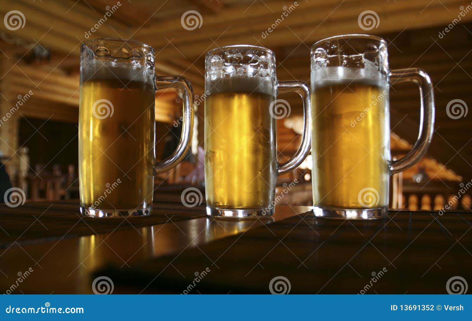 Three beer stock photo. Image of alcohol, table, froth - 13691352