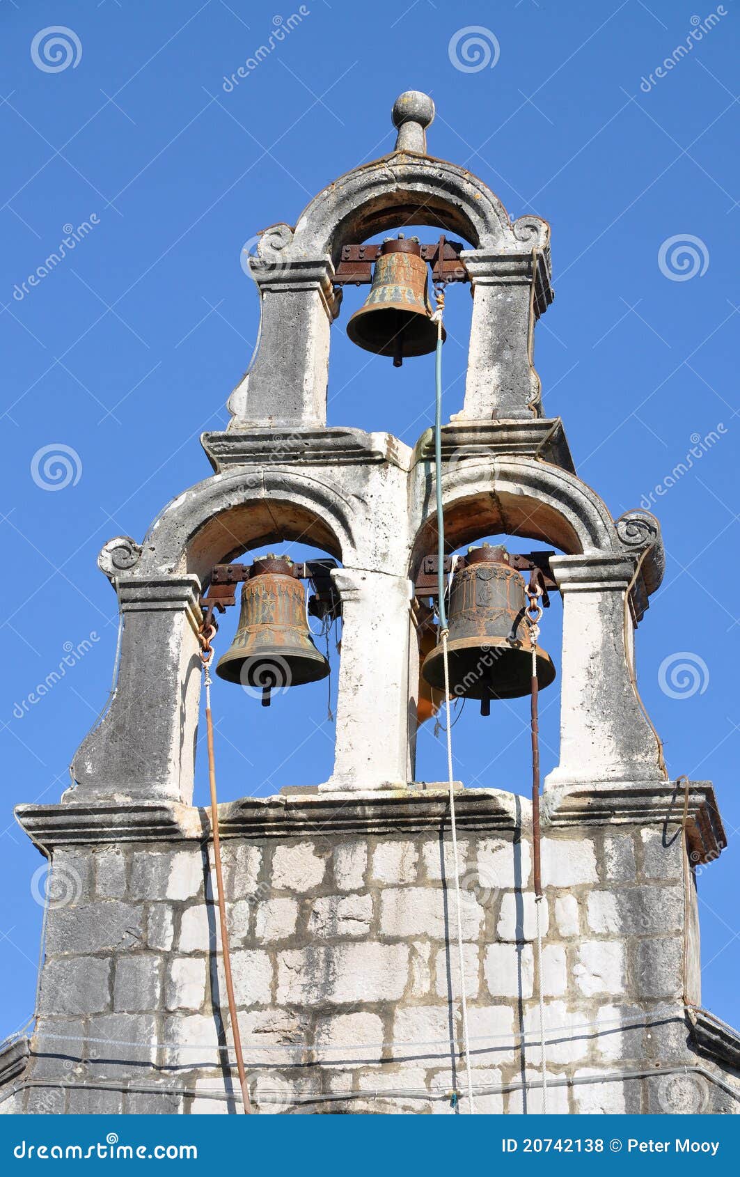 Three bells in clock tower stock photo. Image of ropes - 20742138