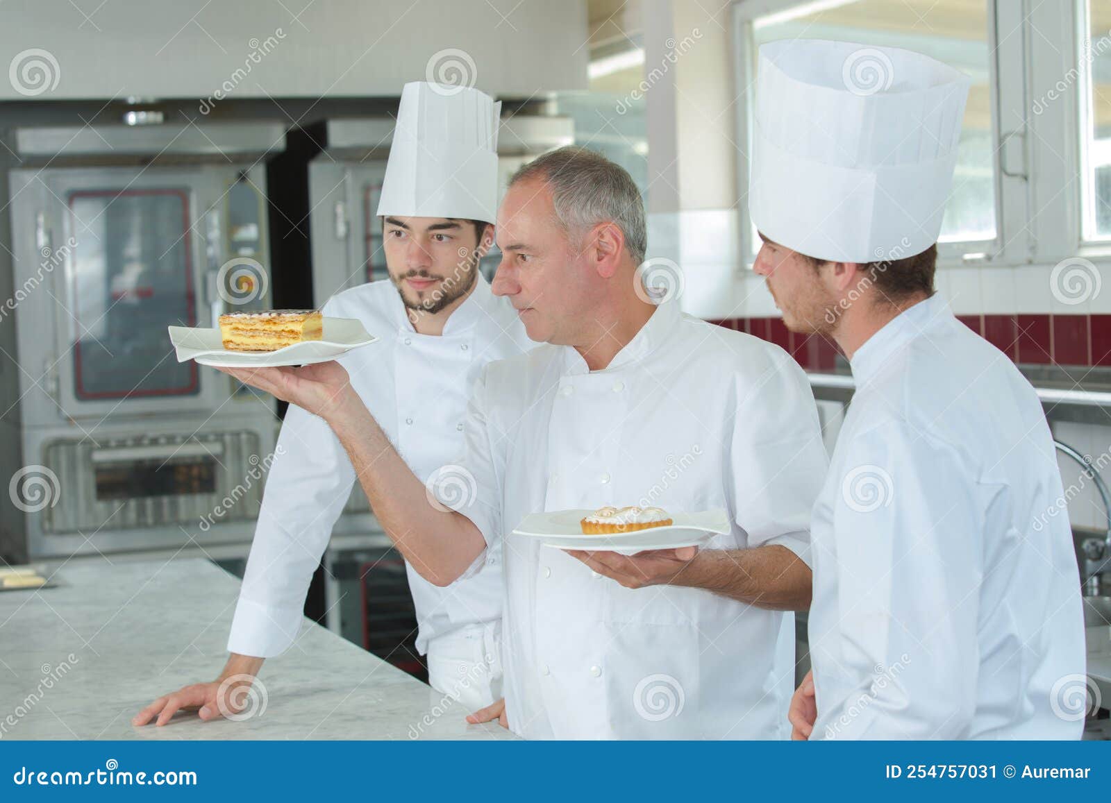 Three Best Cooks Doing Their Work Stock Image - Image of decorating ...