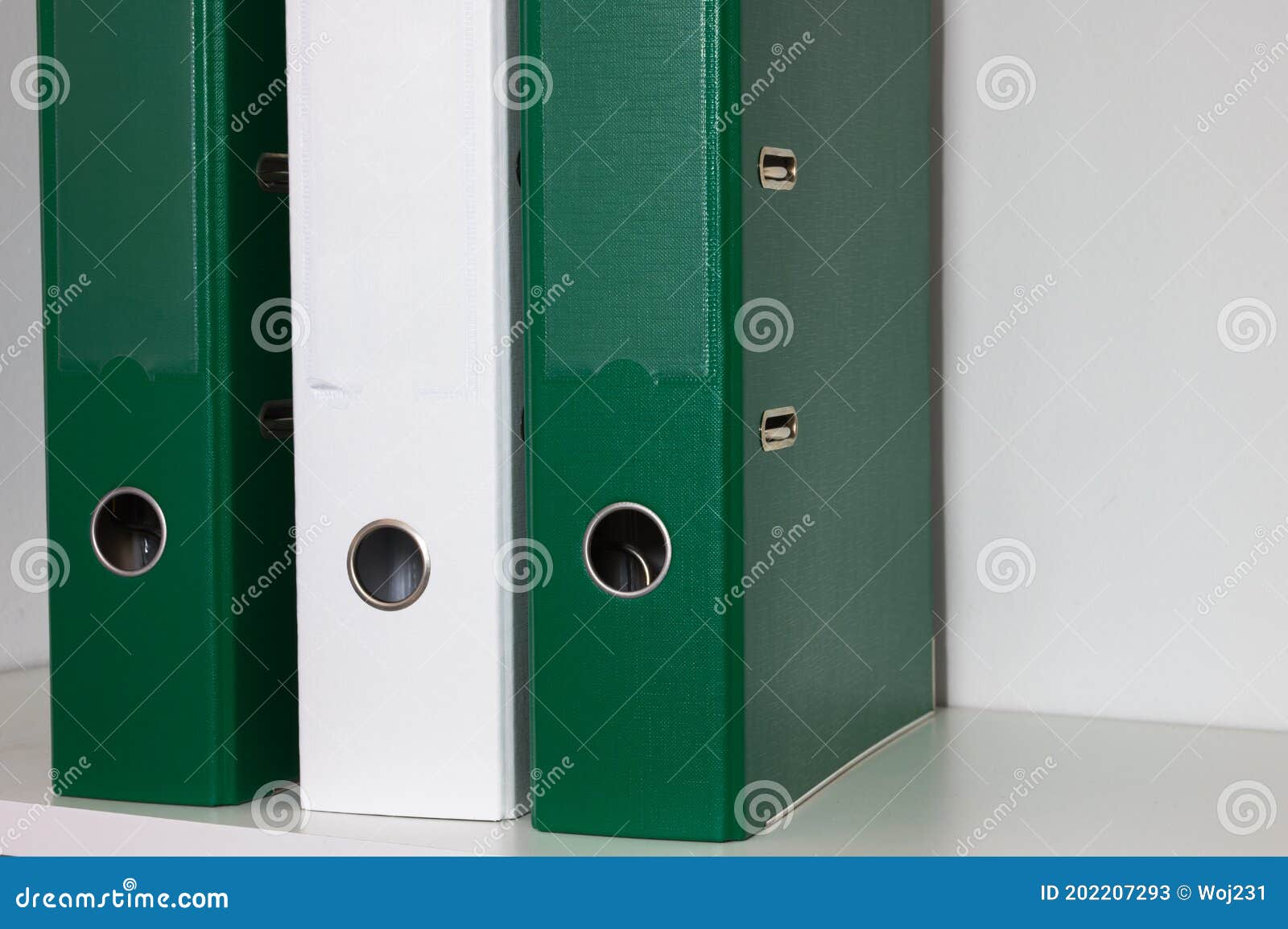 Three binders on the shelf stock image. Image of colorful - 202207293