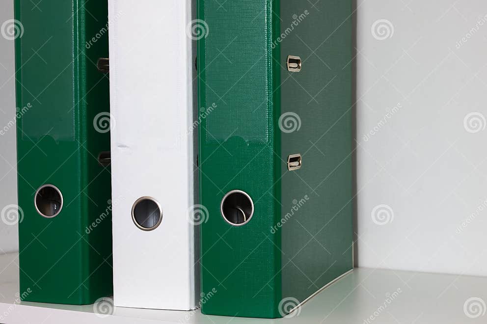 Three binders on the shelf stock image. Image of colorful - 202207293
