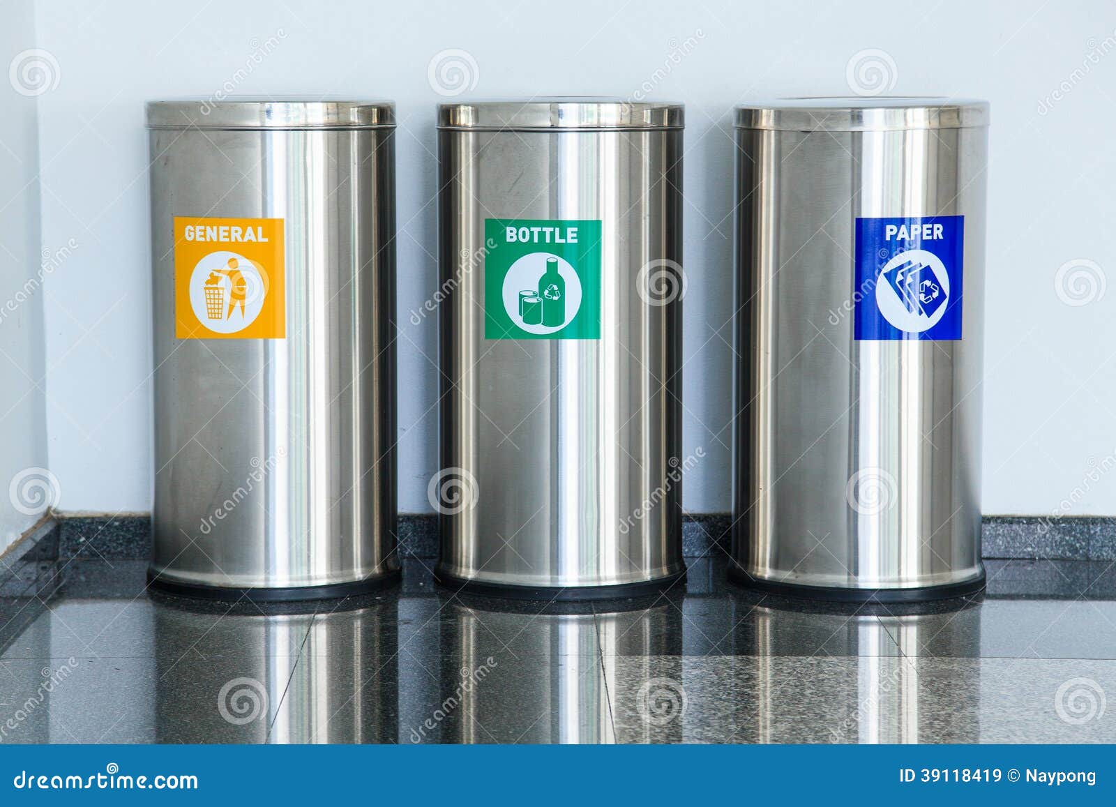 Three Bins Full Of Garbage And Overflowing Outside. Stock Photo ...