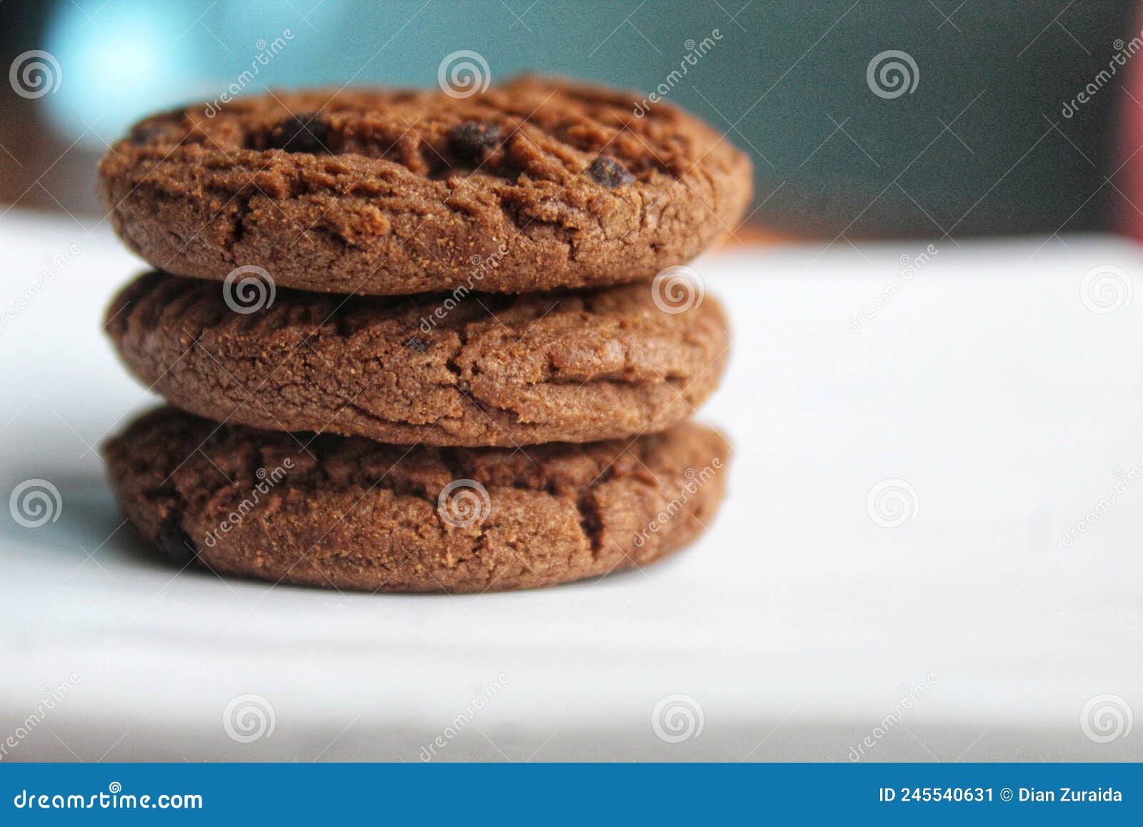 Three biscuits on a plate stock image. Image of confectionery - 245540631