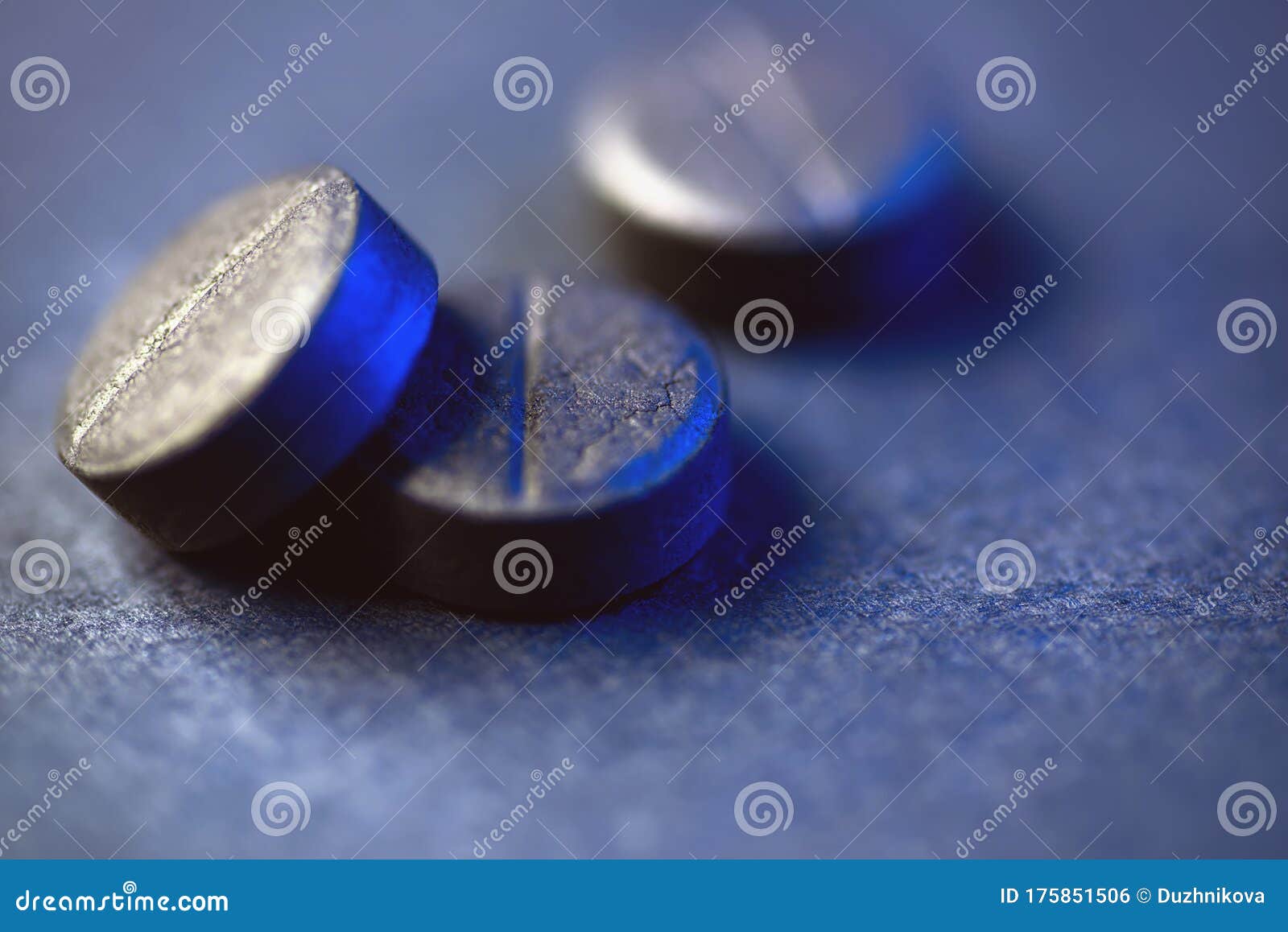 Three Black Activated Charcoal Tablets. on a Black Background Stock ...