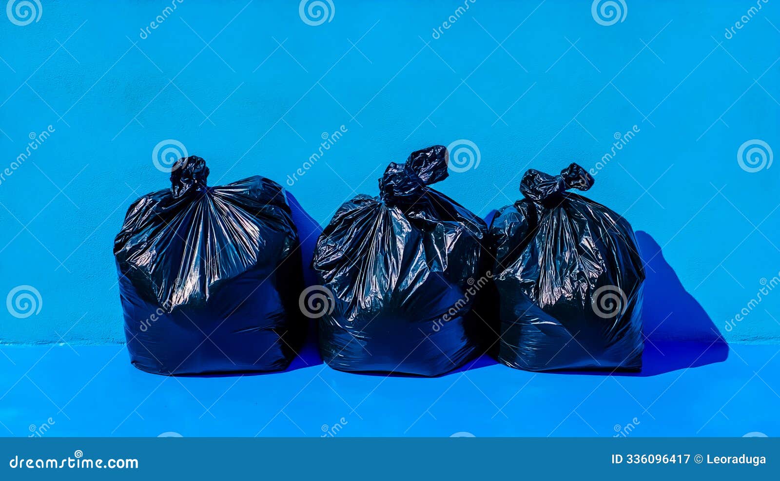 Three Black Garbage Bags Sitting on a Blue Surface Stock Illustration ...