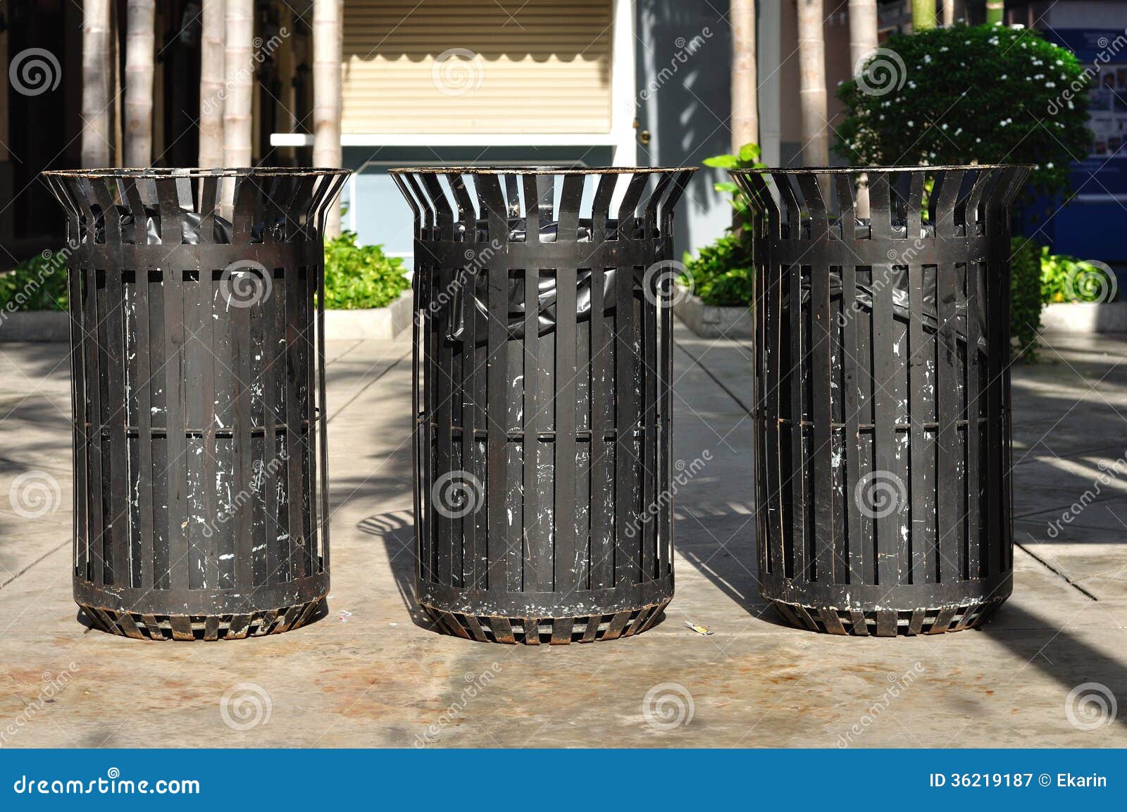 Three Black Iron Bins in Public Street Stock Image - Image of fence ...