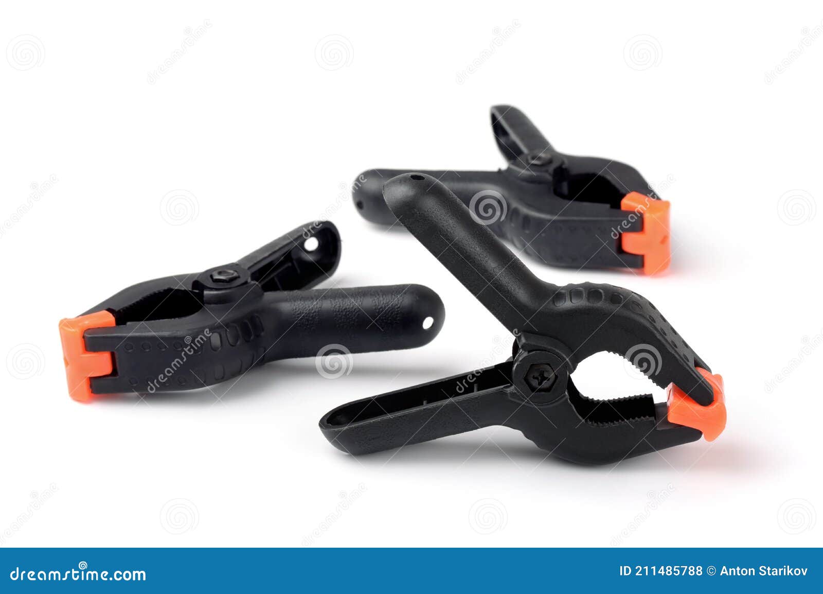 Three Black Plastic Spring Clamps Stock Photo - Image of heavy ...