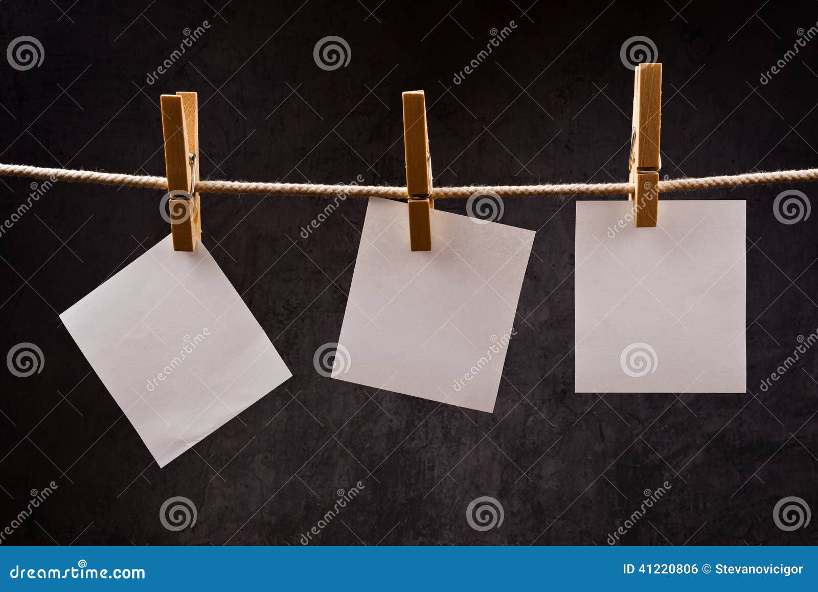 Three Blank Paper Notes Hanging on Rope with Clothes Pins Stock Photo ...