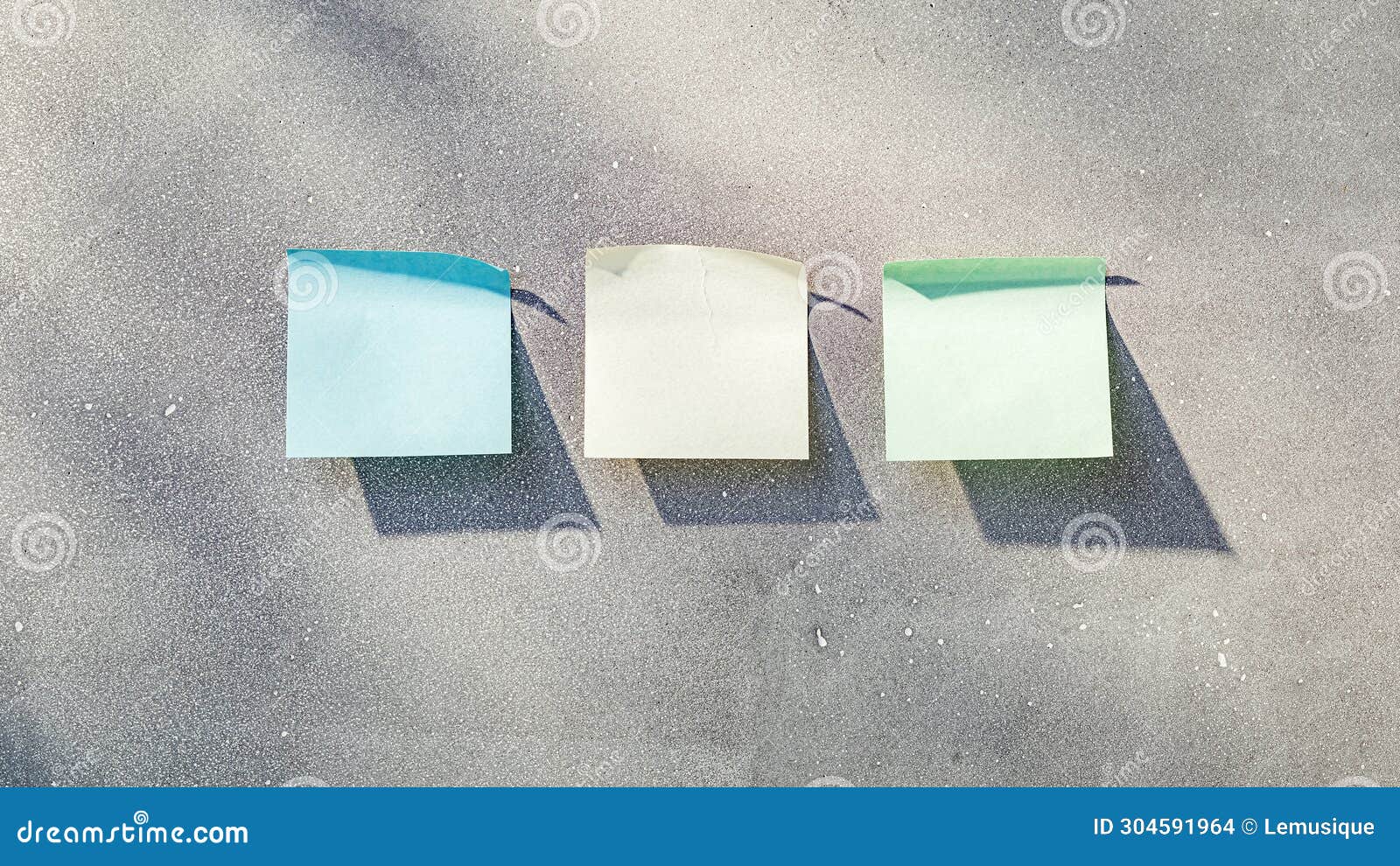 Three Blank Sticky Notes Pinned To a Textured Grey Wall in Natural ...