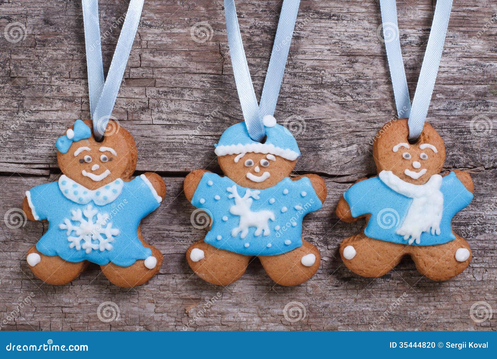 Three blue gingerbread men stock photo. Image of celebration - 35444820