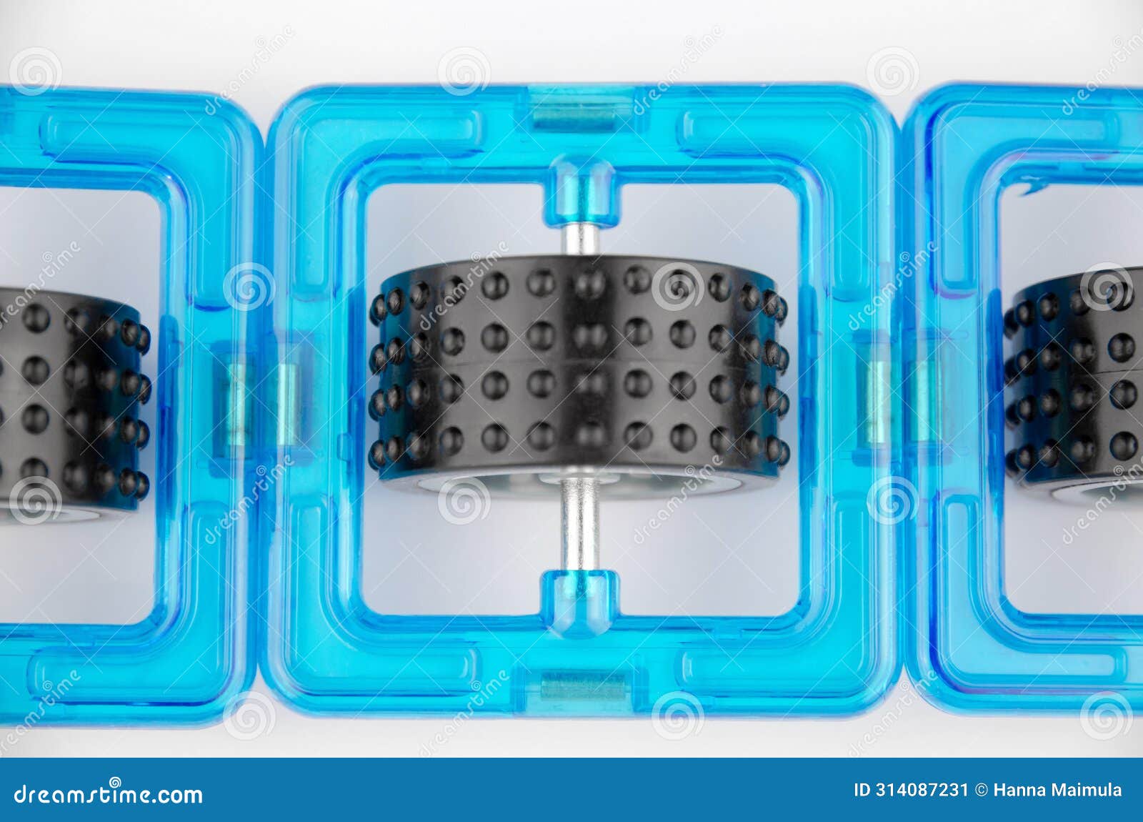 Three Blue Transparent Magnet Squares with Black Wheels Inside Stock ...